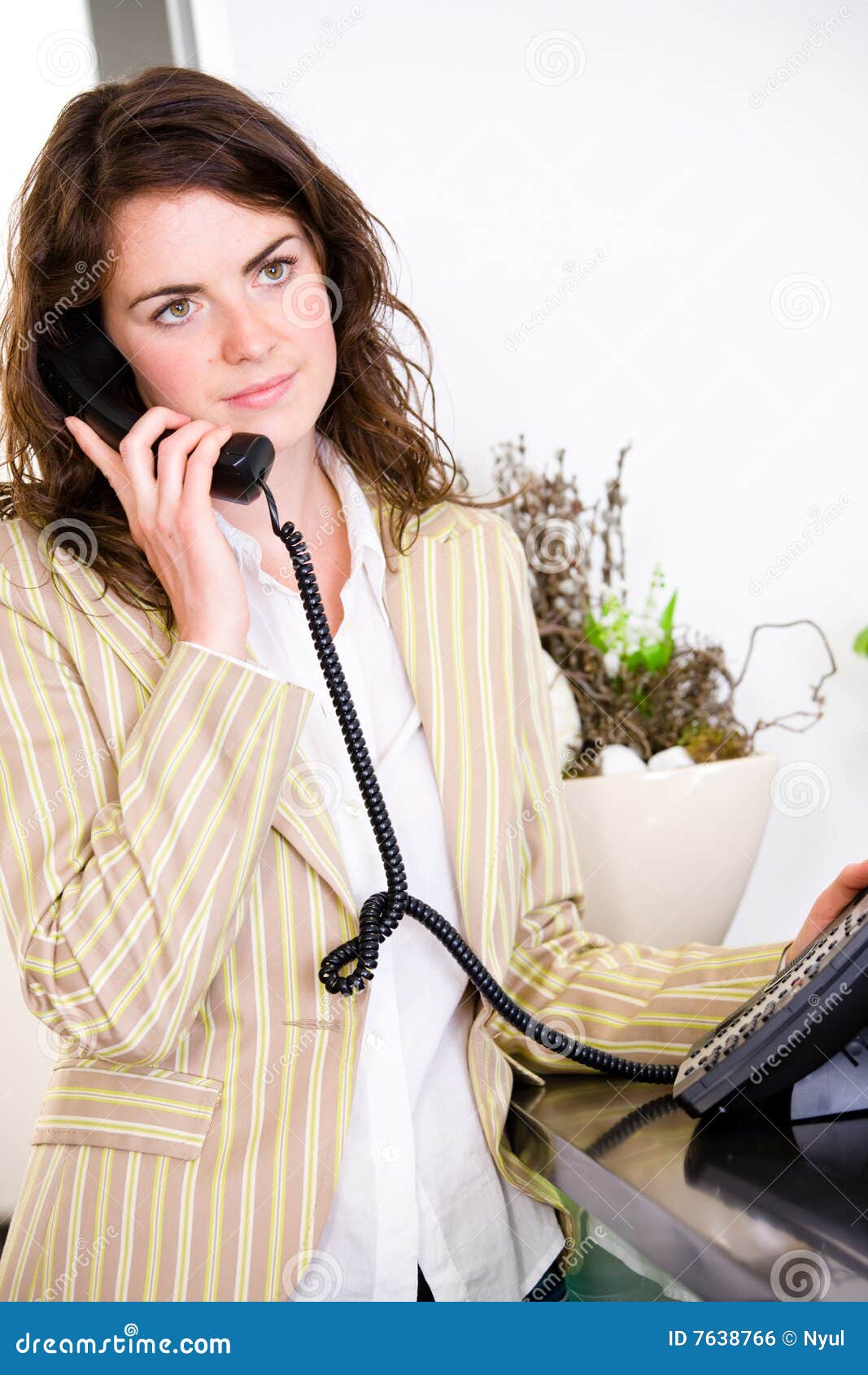 Receptionist Calling on Phone Stock Photo - Image of attractive ...