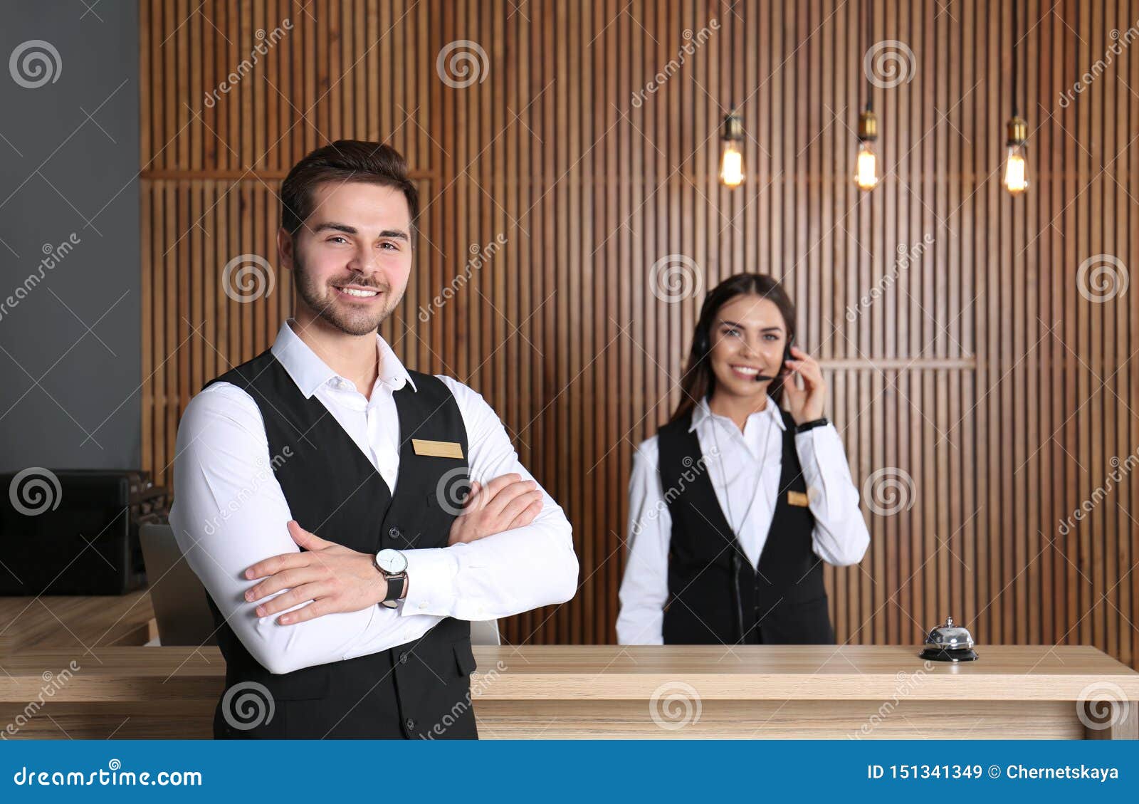 Receptionist at Desk with Colleague Stock Image - Image of headset ...