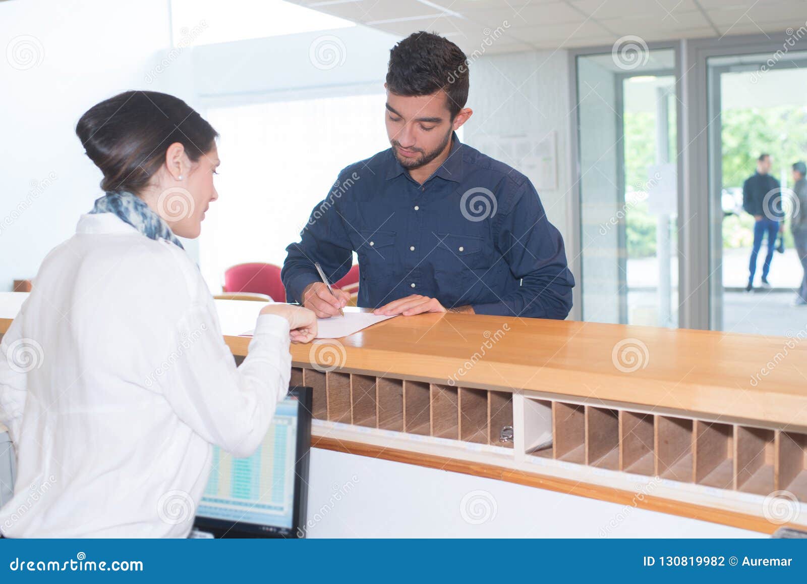 Receptionist Explaining To Client Stock Photo - Image of female ...