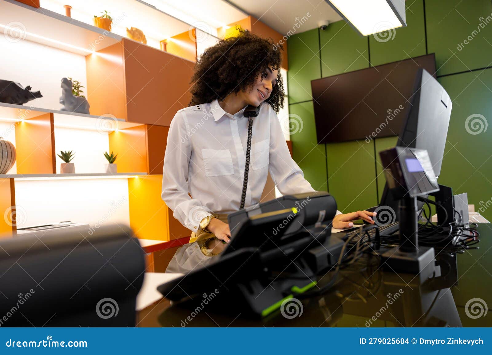 Receptionist Having a Call and Looking Busy Stock Photo - Image of ...