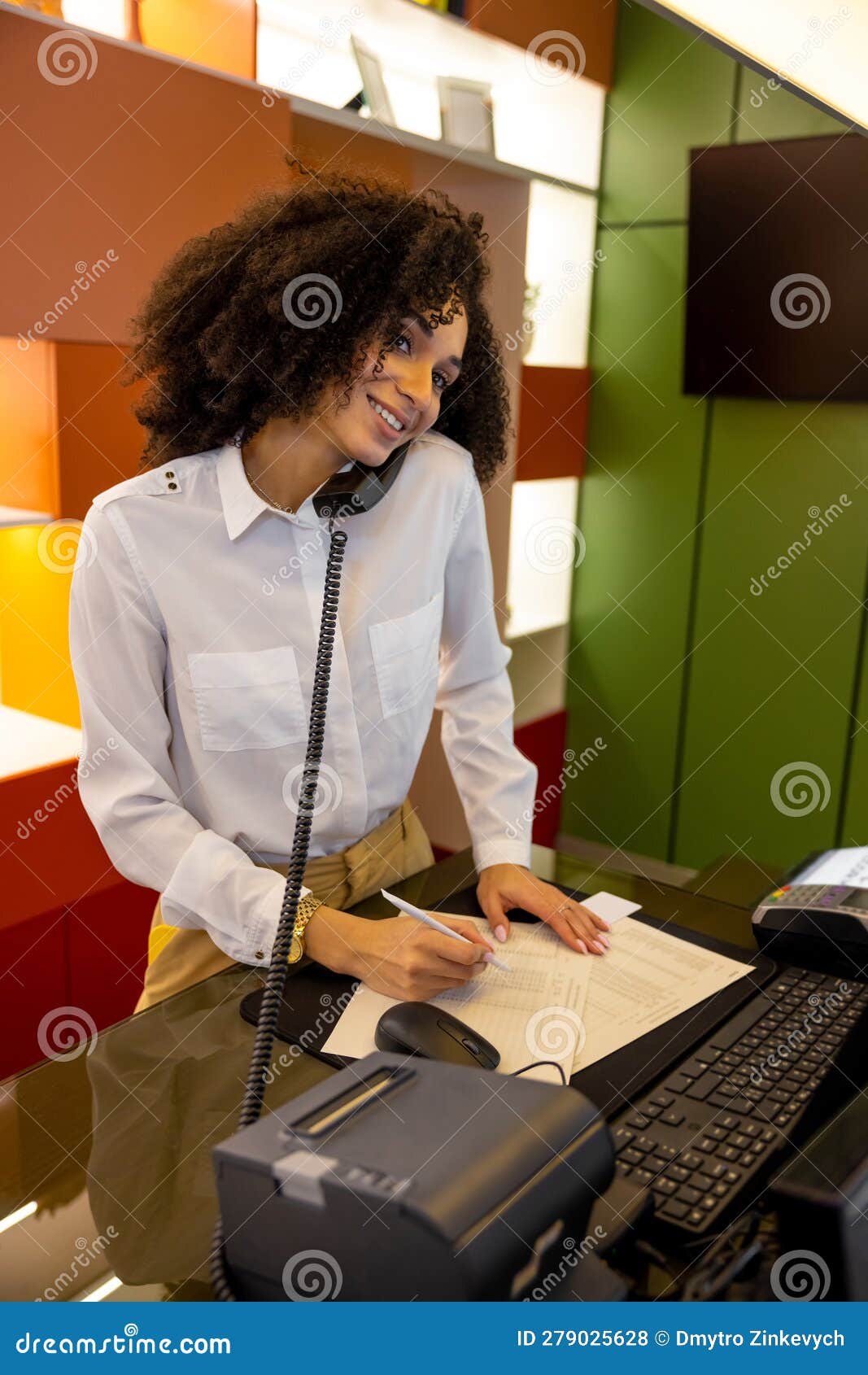 Receptionist Having a Call and Looking Busy Stock Photo - Image of ...