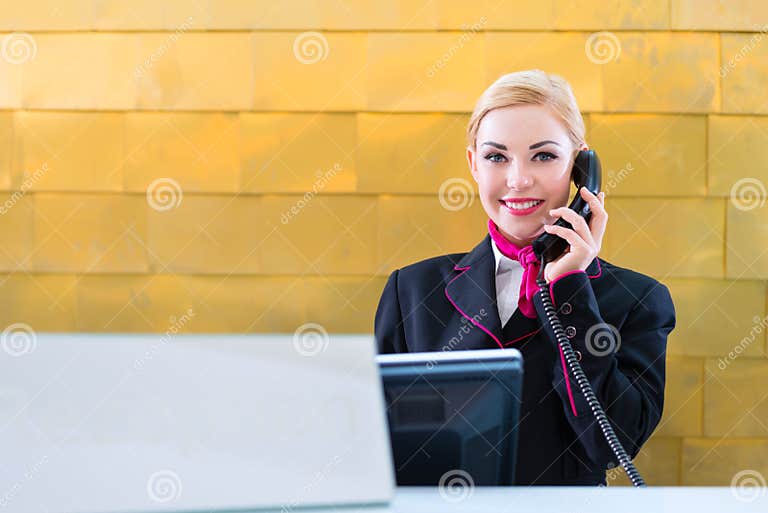 Receptionist with Phone on Front Desk in Hotel Stock Photo - Image of ...