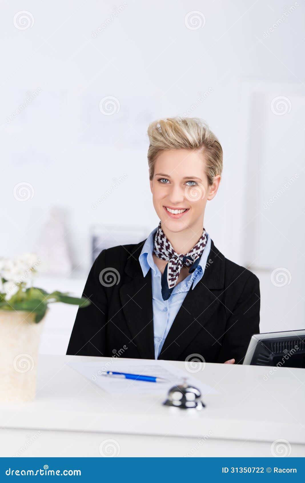 Receptionist Smiling at Desk Stock Photo - Image of check ...