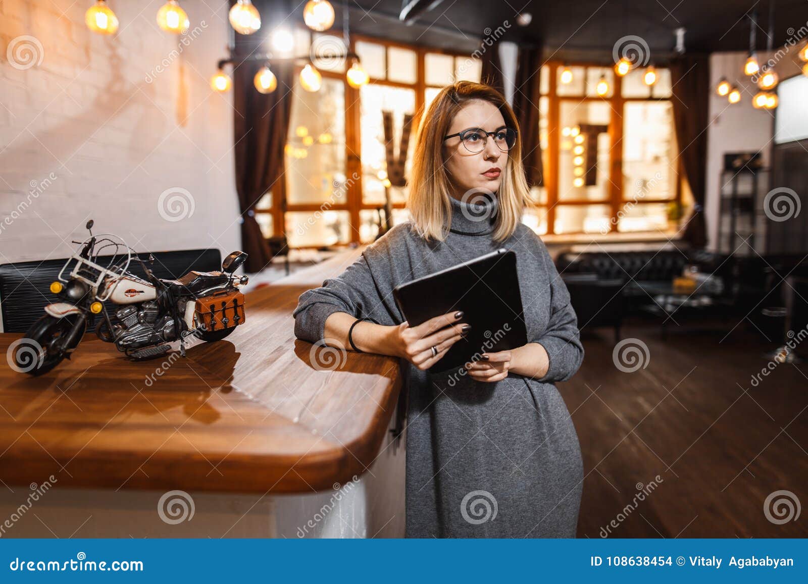 Receptionist Standing at Reception Counter in Office Stock Photo ...