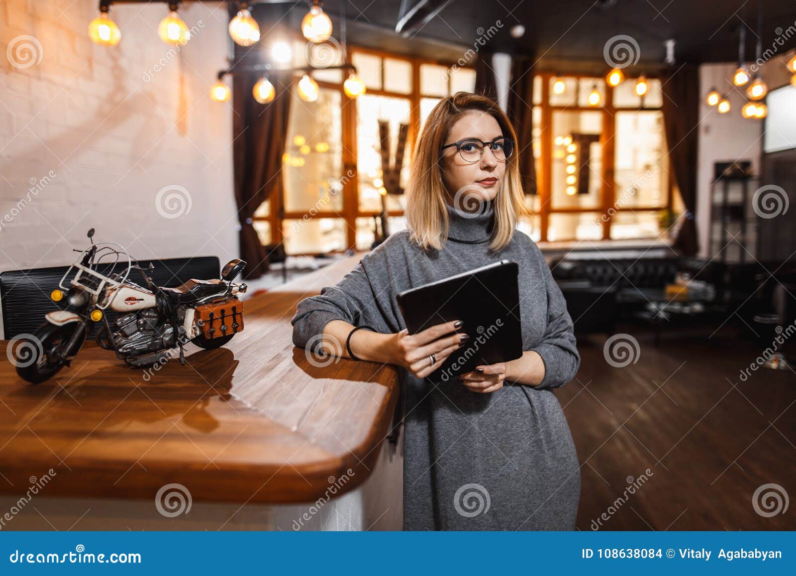 Receptionist Standing at Reception Counter in Office Stock Photo ...