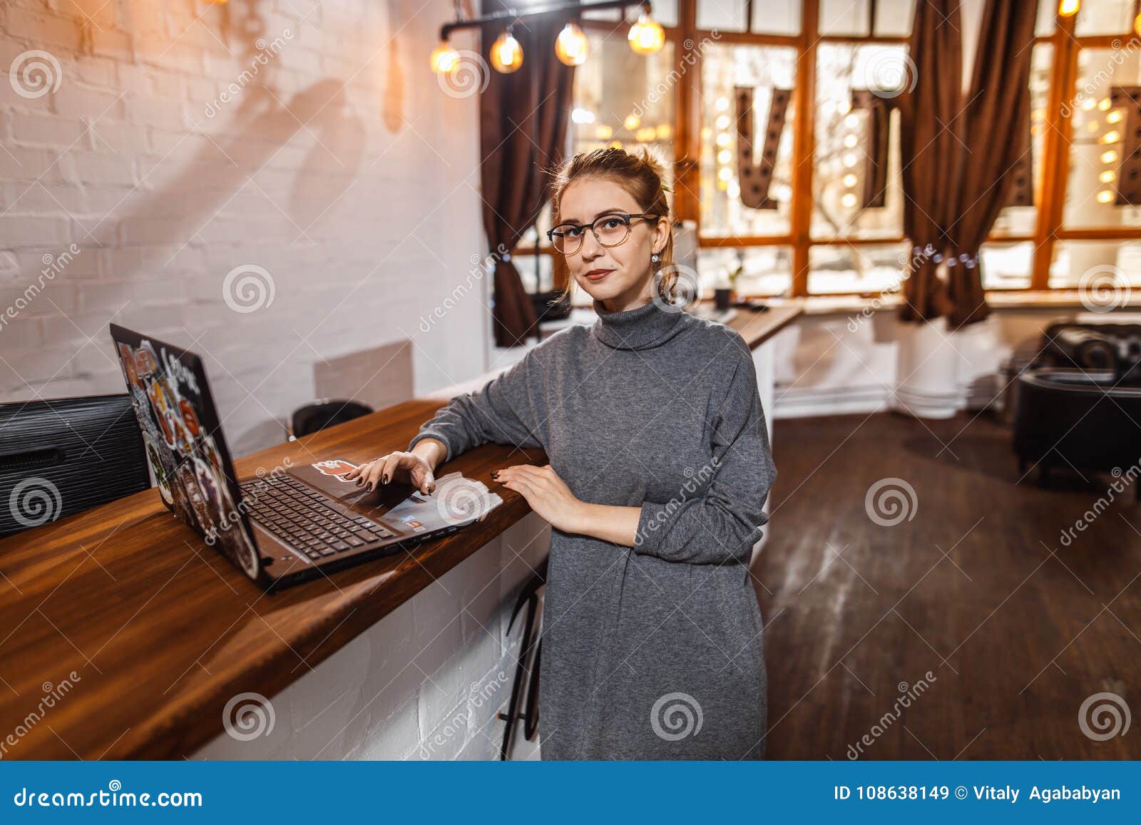 Receptionist Standing at Reception Counter in Office Stock Image ...