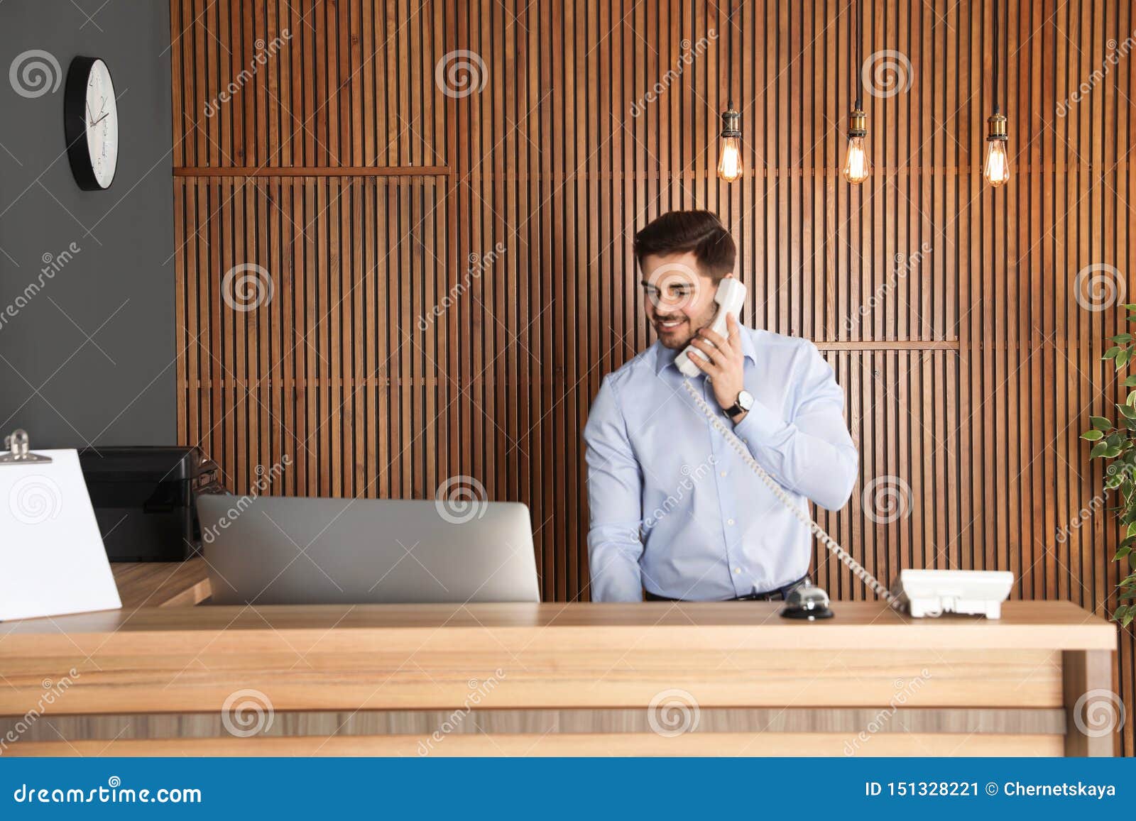 Receptionist Talking on Phone at Desk Stock Image - Image of caucasian ...
