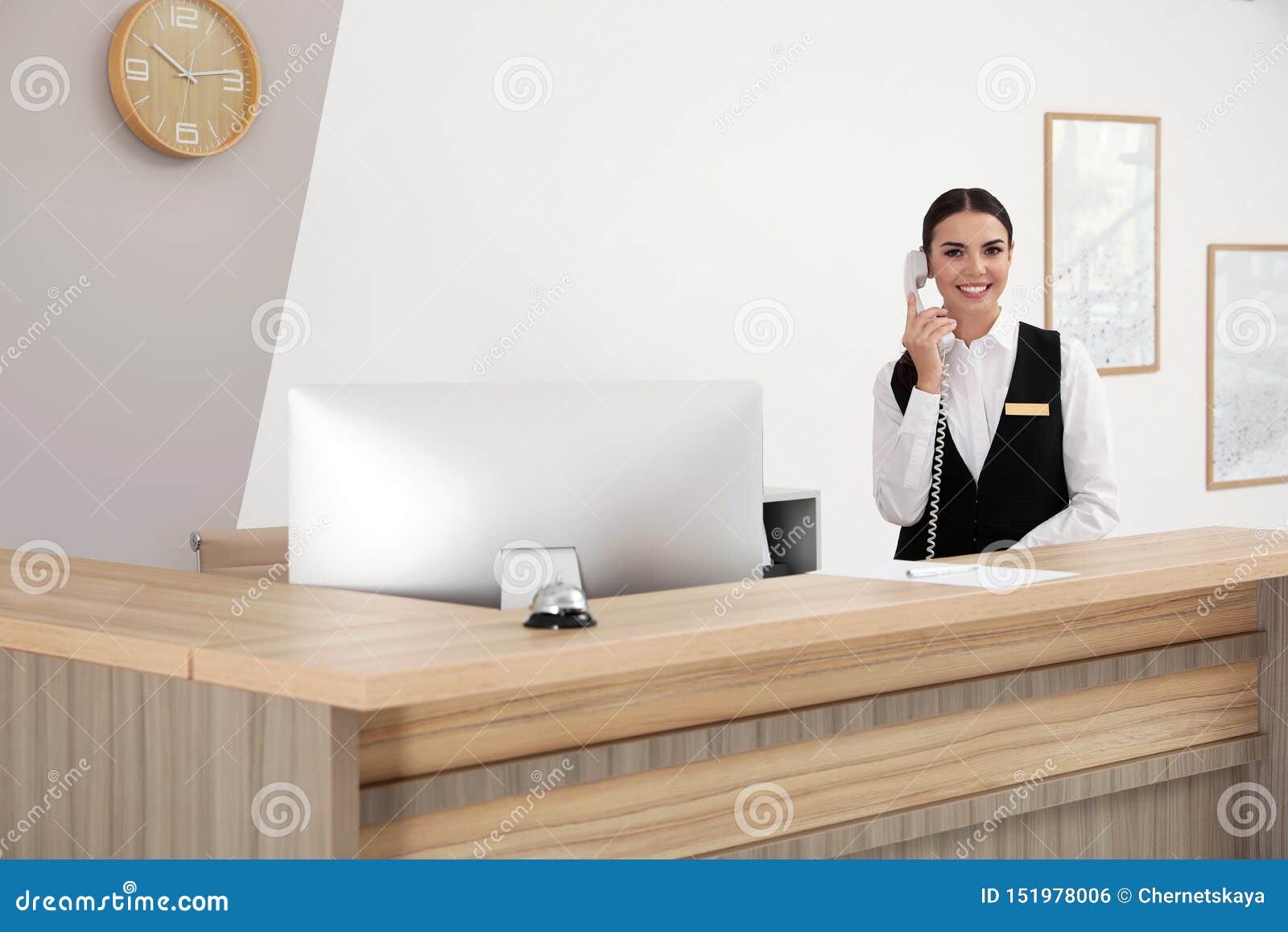 Receptionist Talking on Telephone Near Desk Stock Photo - Image of call ...
