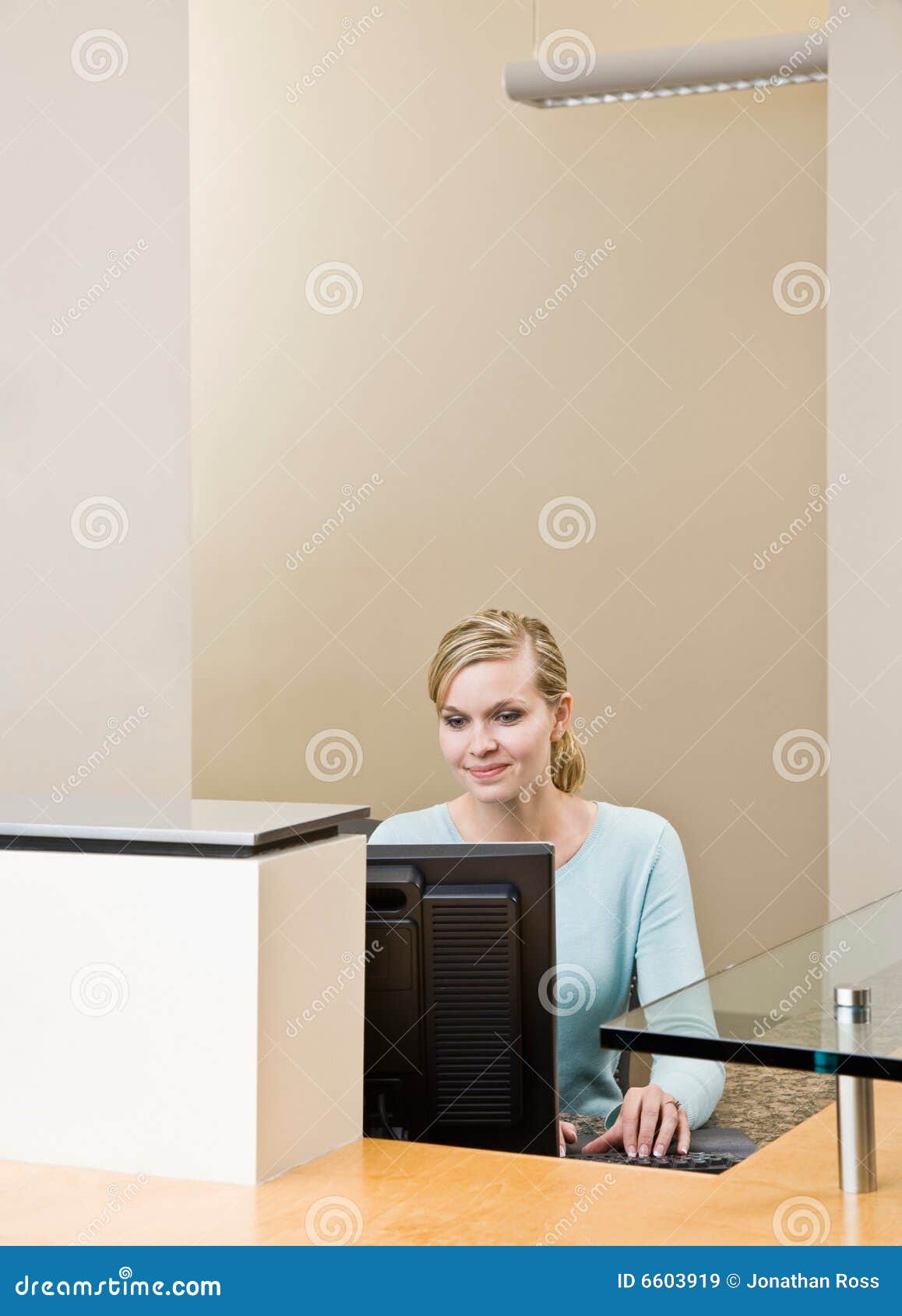 Receptionist Working on Computer Stock Image - Image of executive ...