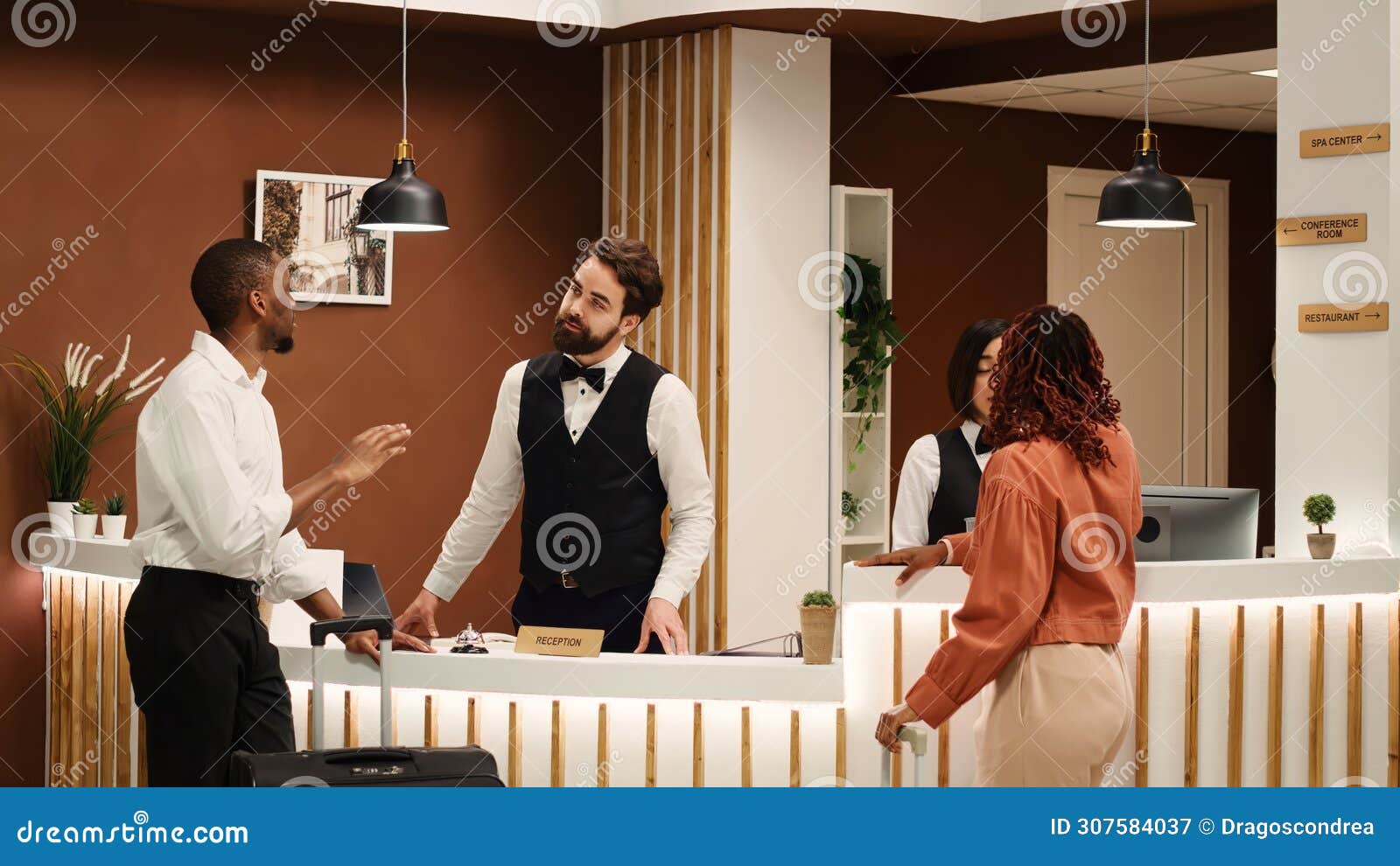 Receptionists Answering Guests Inquiries Stock Image - Image of ...