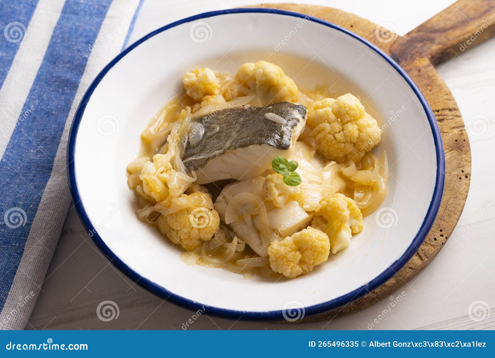 Cod Loins Cooked in the Oven with Onion and Cauliflower. Stock Image ...