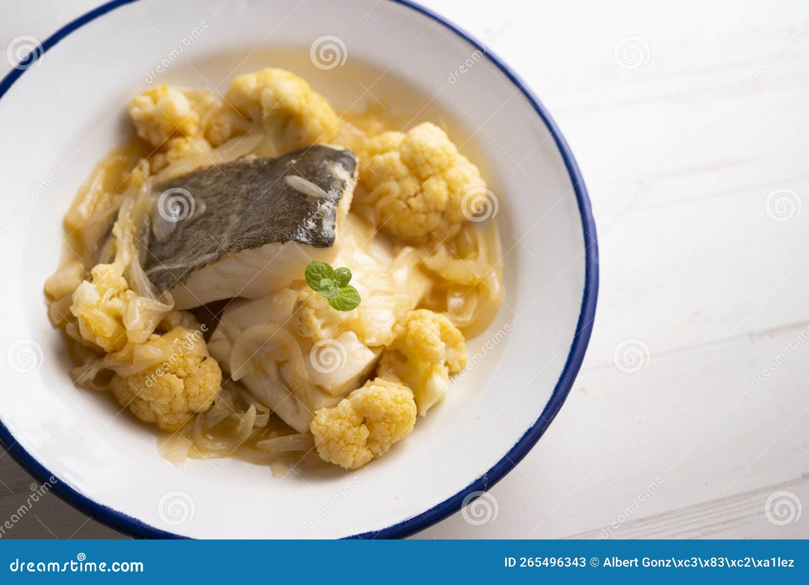 Cod Loins Cooked in the Oven with Onion and Cauliflower. Stock Image ...