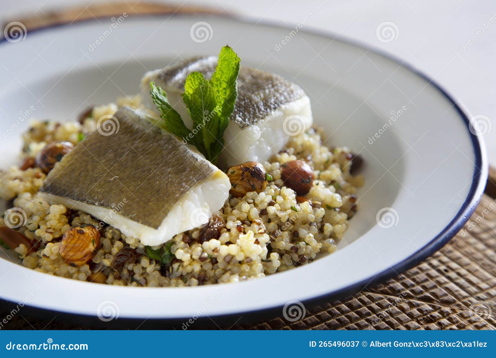 Cod Loins Cooked in the Oven with Quinoa and Peach. Stock Image - Image ...