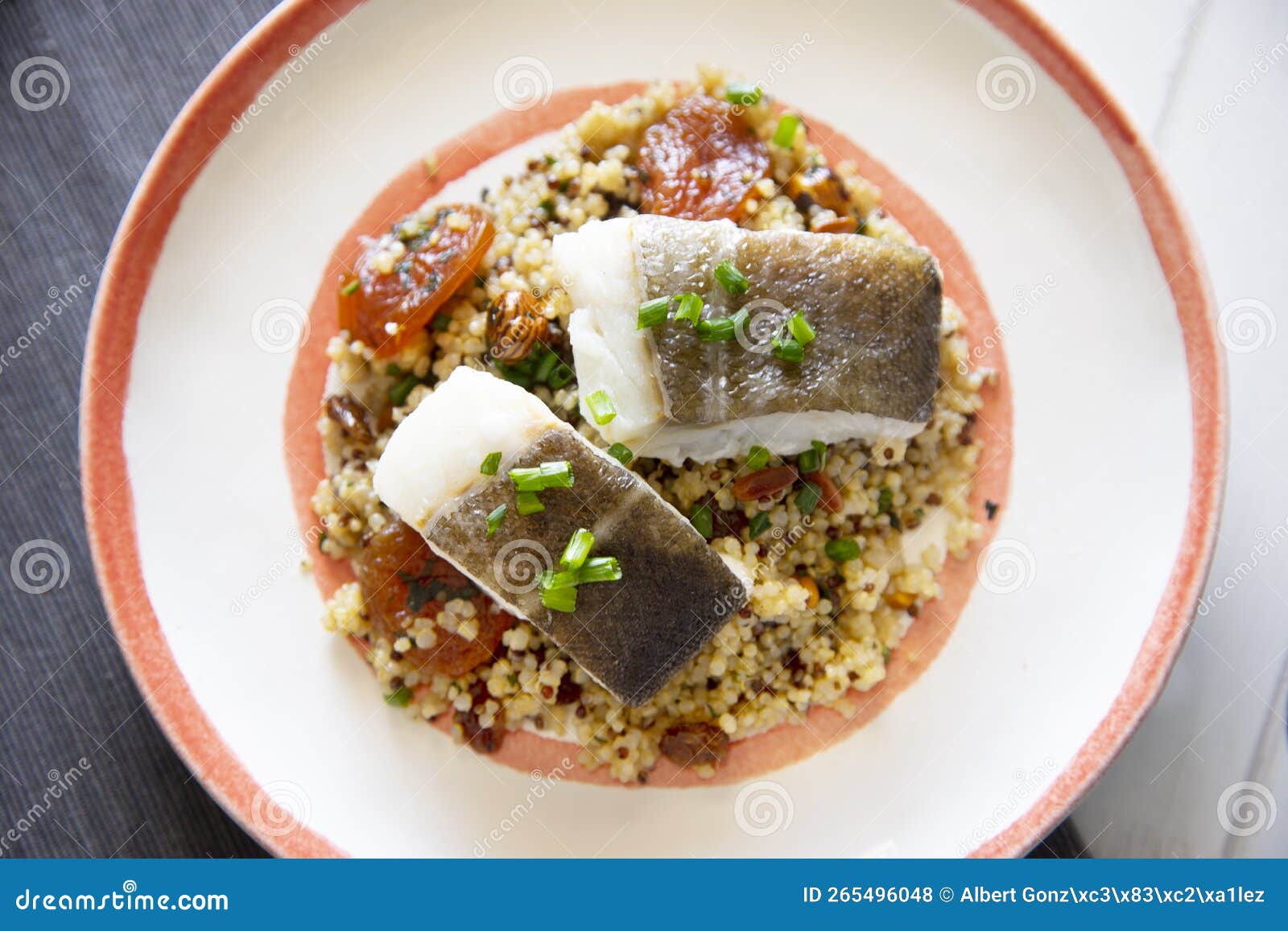 Cod Loins Cooked in the Oven with Quinoa and Peach. Stock Photo - Image ...
