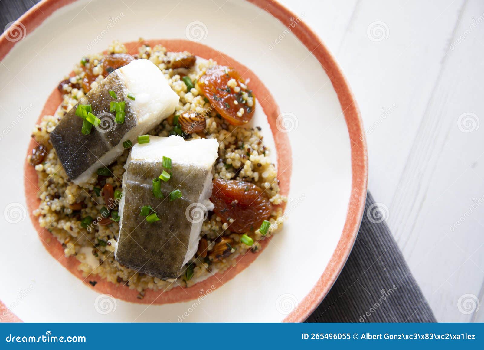 Cod Loins Cooked in the Oven with Quinoa and Peach. Stock Image - Image ...