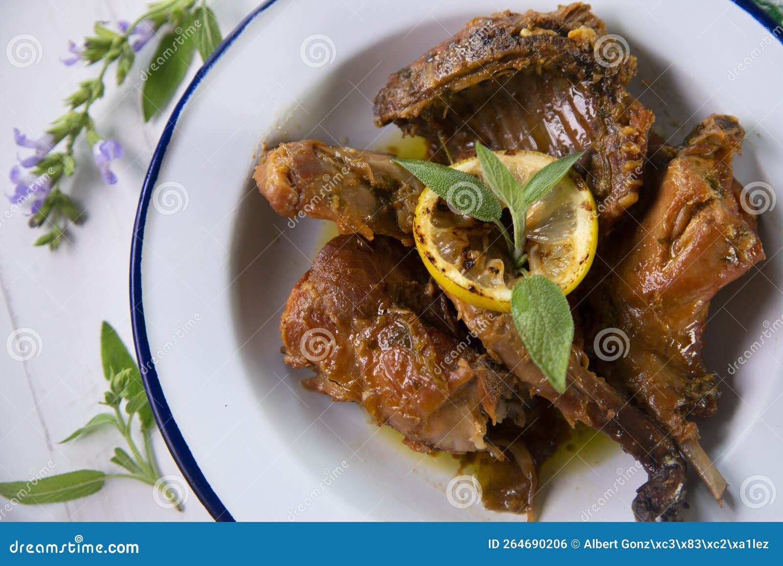Fried Rabbit Cooked with Young Garlic and Sage. Typical Spanish Tapa ...