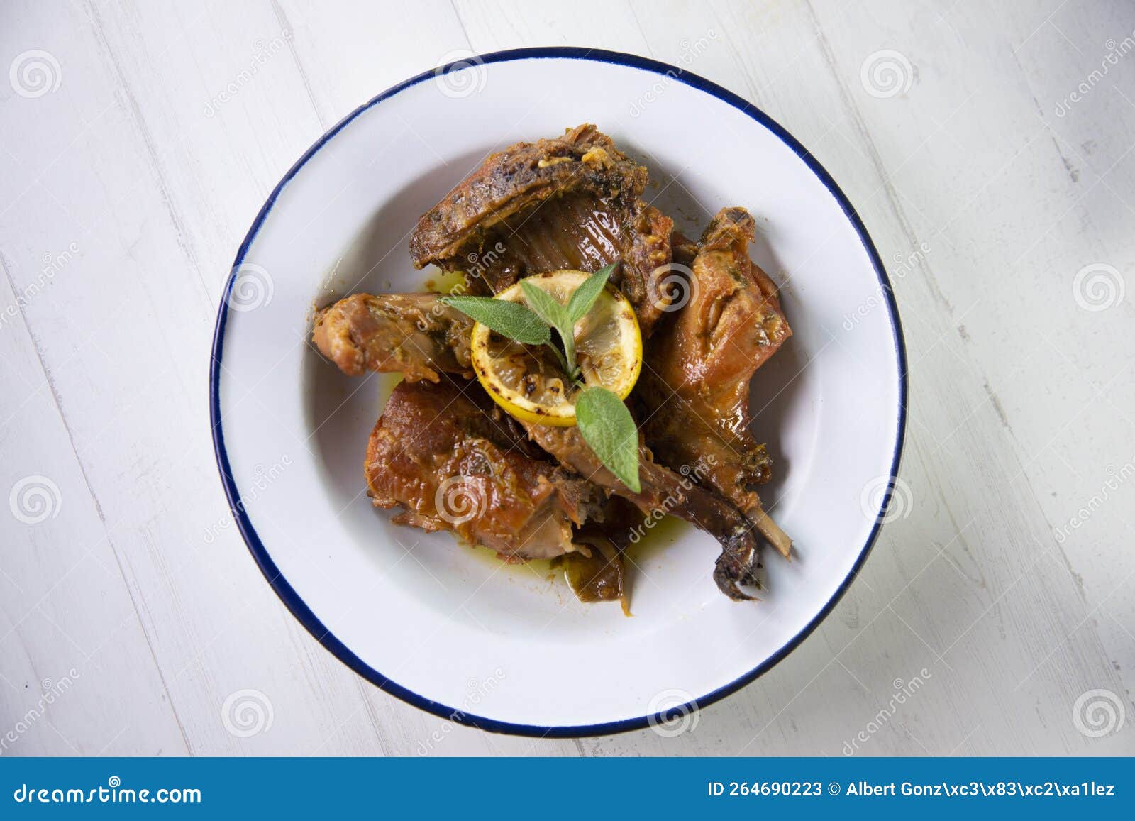Fried Rabbit Cooked with Young Garlic and Sage. Typical Spanish Tapa ...