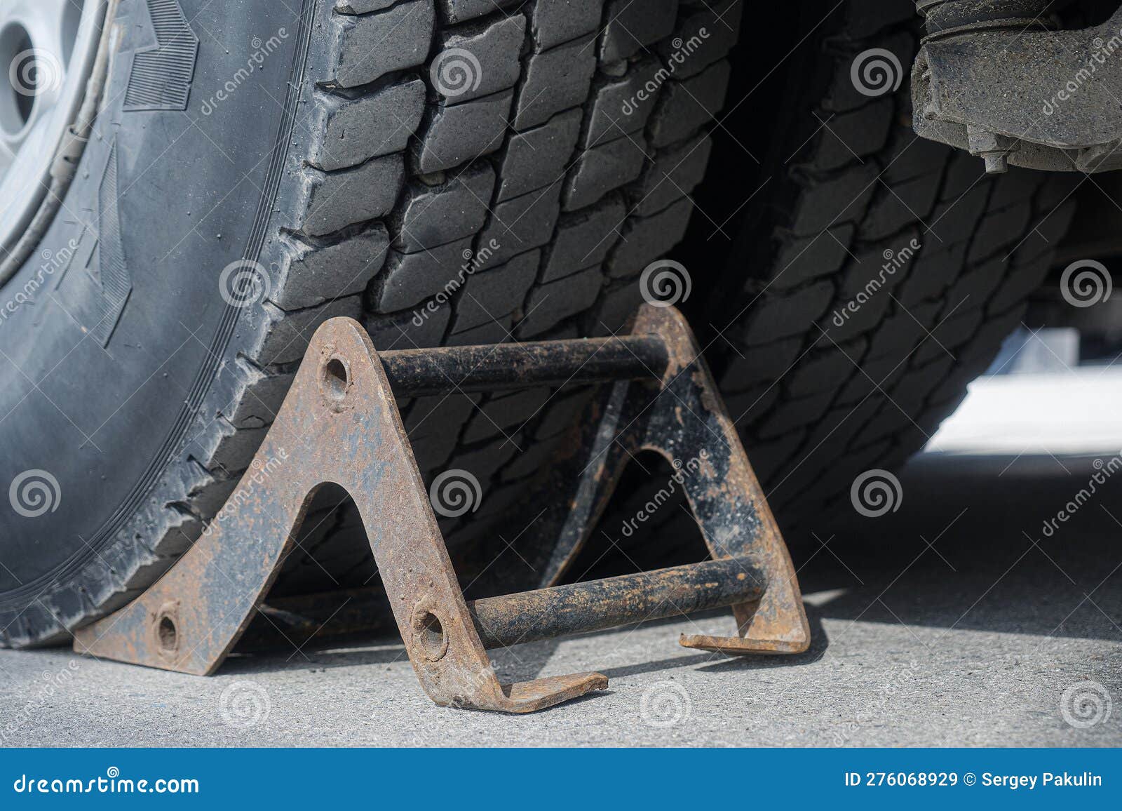 Recoil is Installed Under Wheel of Truck. Security. Background Stock ...