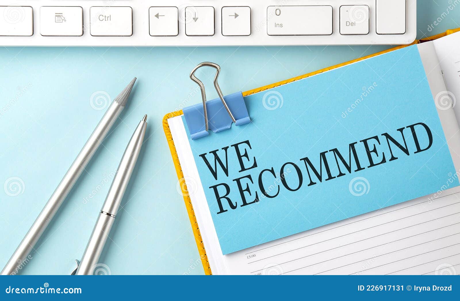 We RECOMMEND Text on Sticker on the Blue Background with Pen and ...