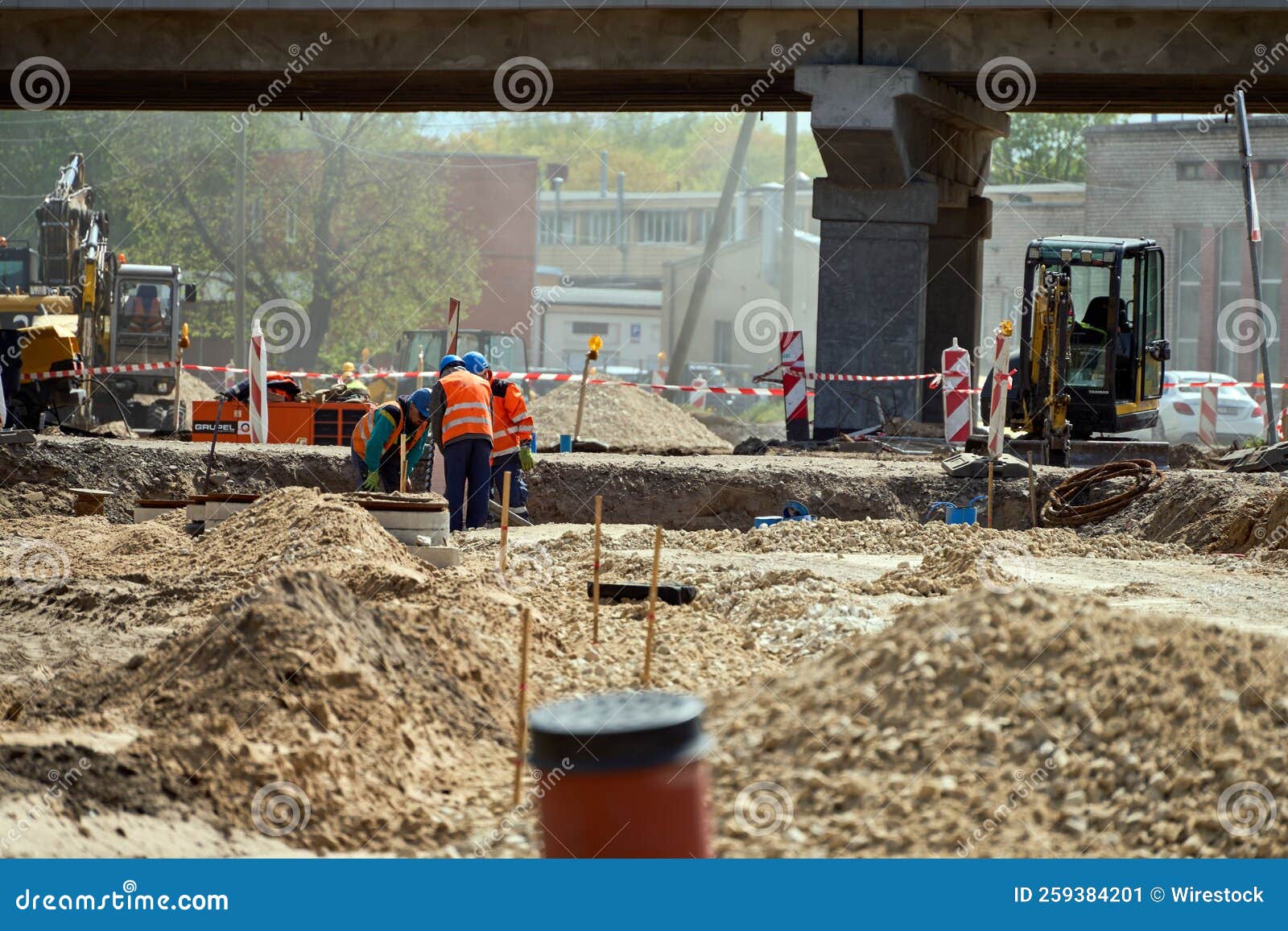 Reconstruction Site with Workers and Machines Under a Bridge Editorial ...