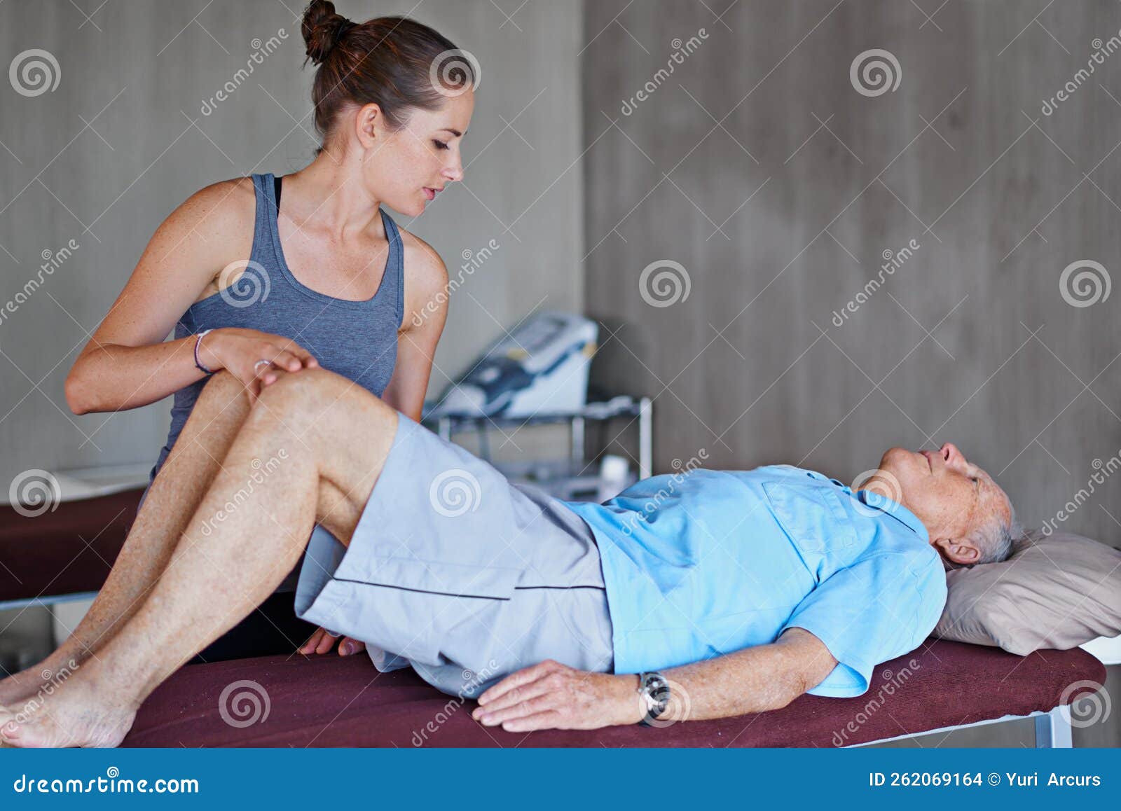 Recovery is a Long Process. an Elderly Man Having a Physiotherapy ...