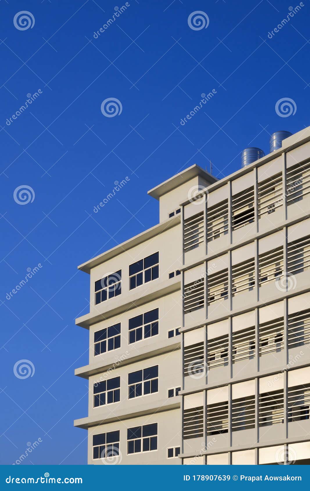 Glass Windows with Baluster on External View of White Building Against ...
