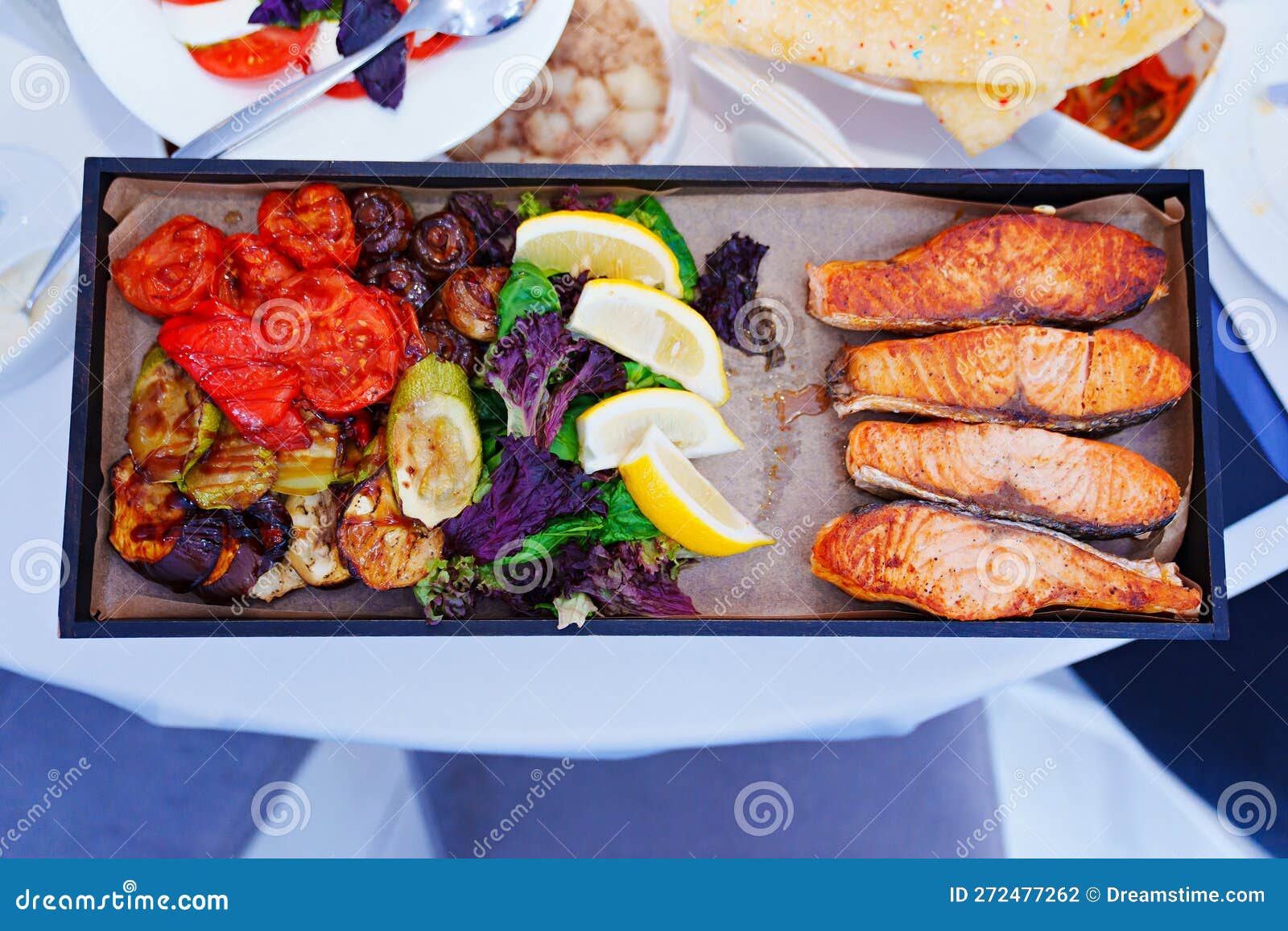 Rectangular Black Dish with Grilled Fish and Vegetables. Stock Photo ...