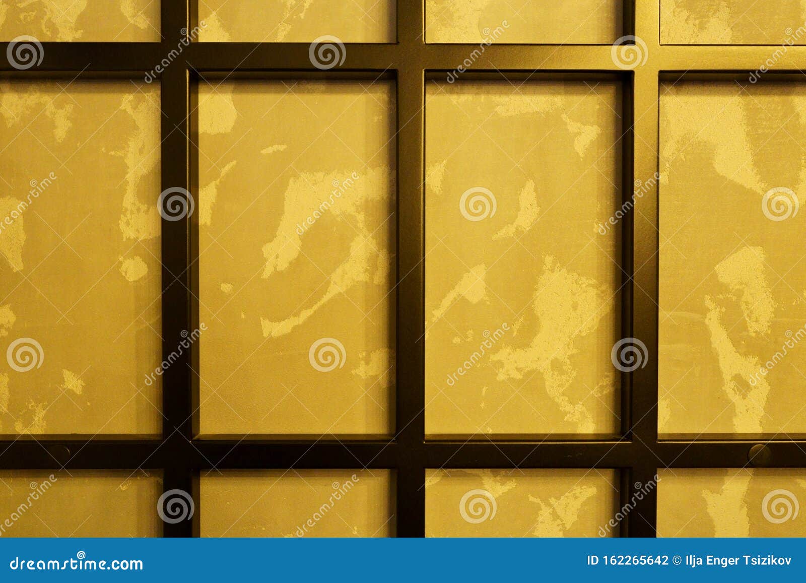 Rectangular Black Metal Grill on the Wall, with a Golden Background ...