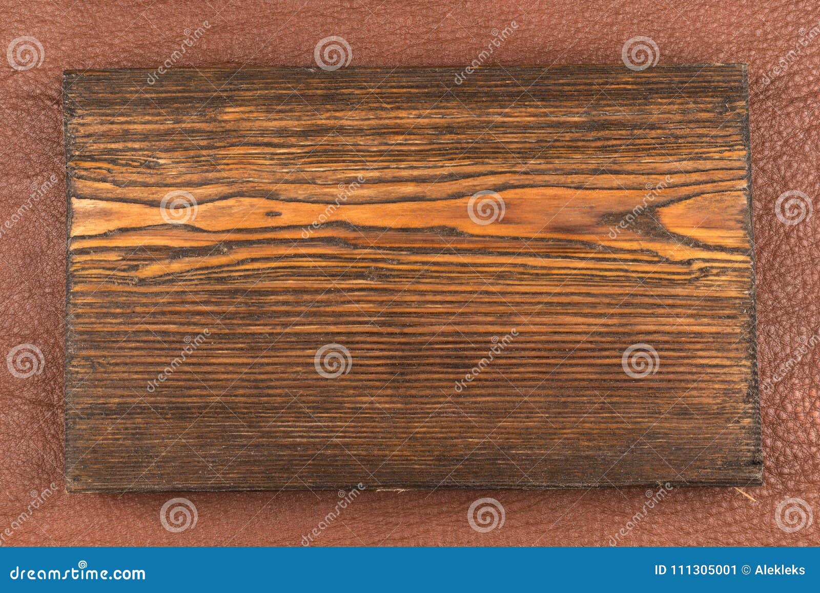 Rectangular Board of Dark Wood Lies on Brown Natural Leather. Texture ...