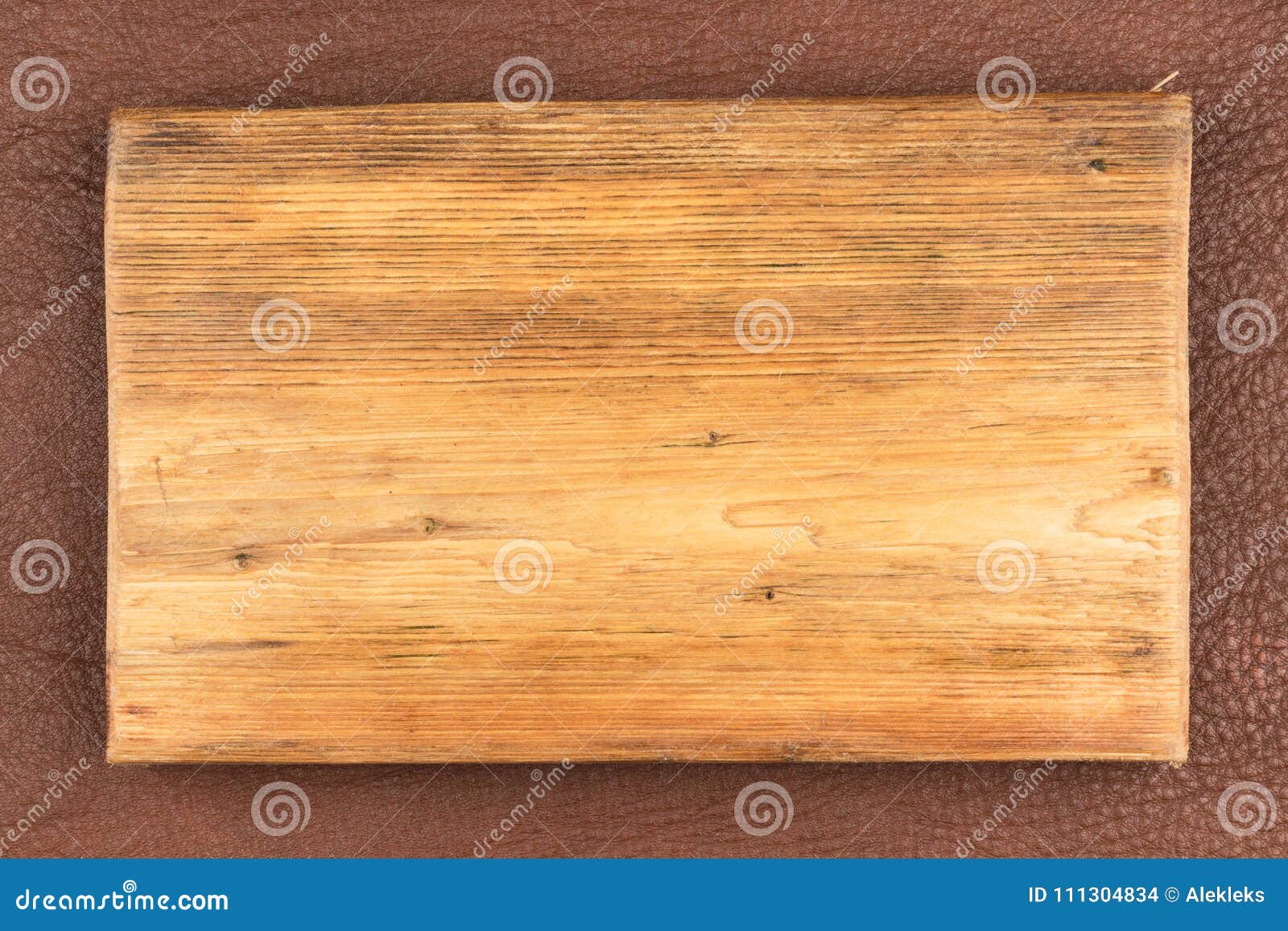 Rectangular Board of Light Wood Lies on Brown Natural Leather. Texture ...