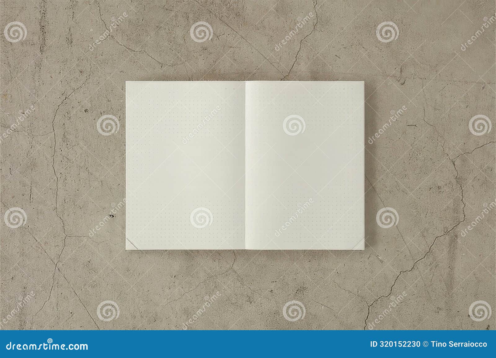 A Rectangular Book Lies on a Beige Concrete Surface with a Circle ...