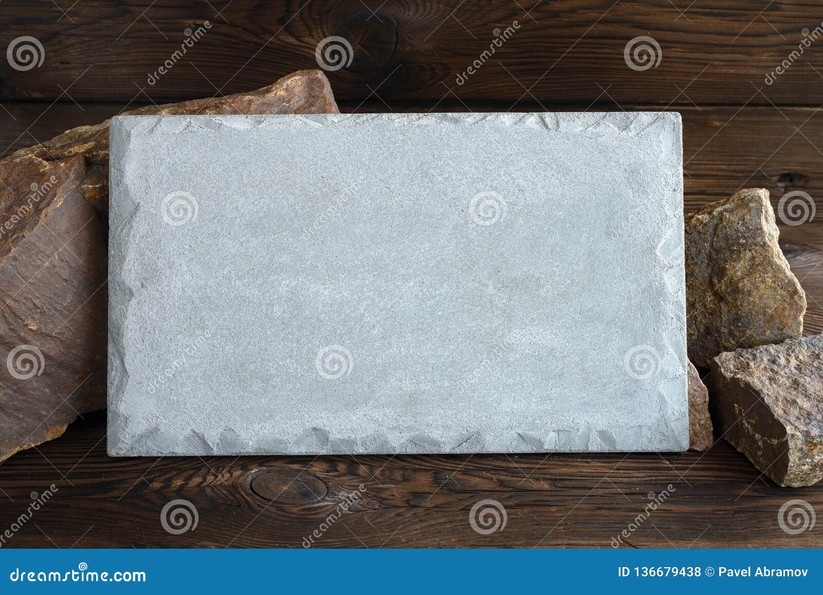 Rectangular Concrete Plate on the Background of Granite Stones. Wooden ...