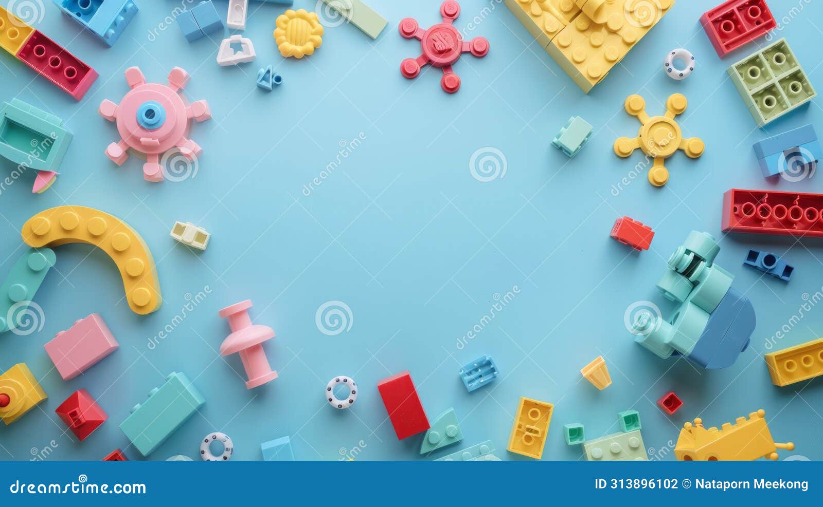 A Rectangular Frame with a Blue Background. Toys are Placed Around the ...