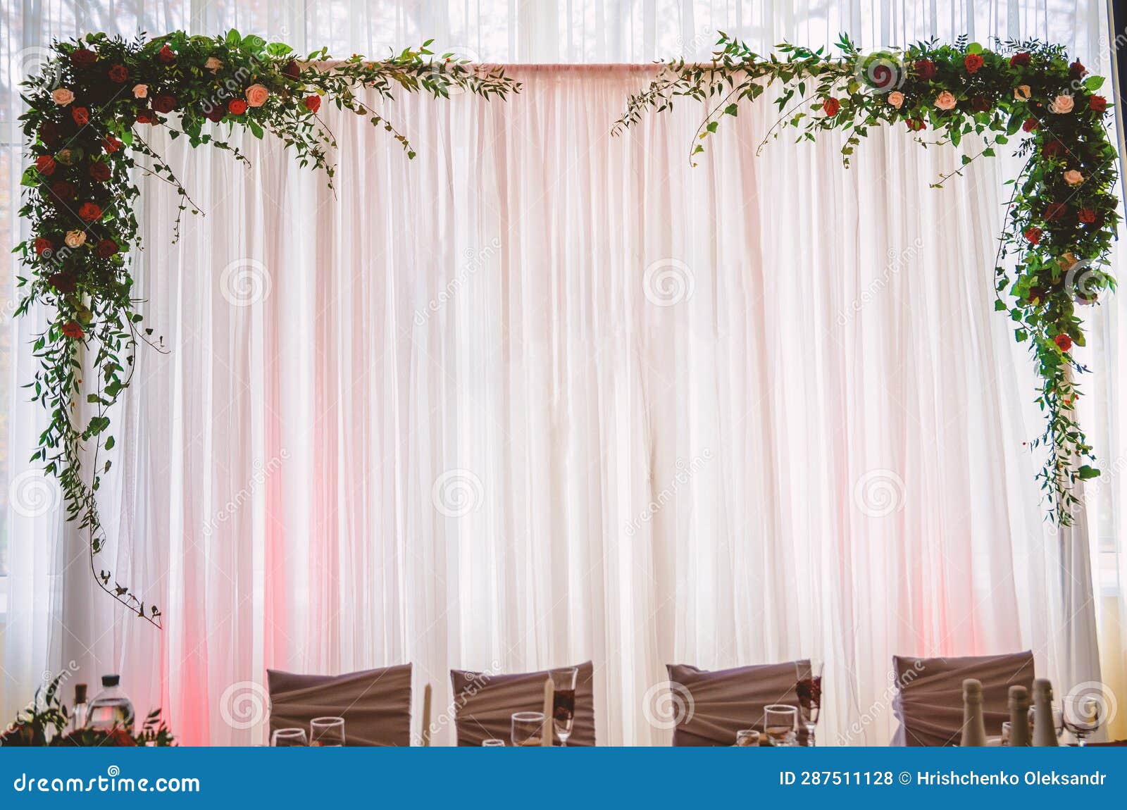 A Rectangular Frame with Plants and White Tulle Decorates the Festive ...