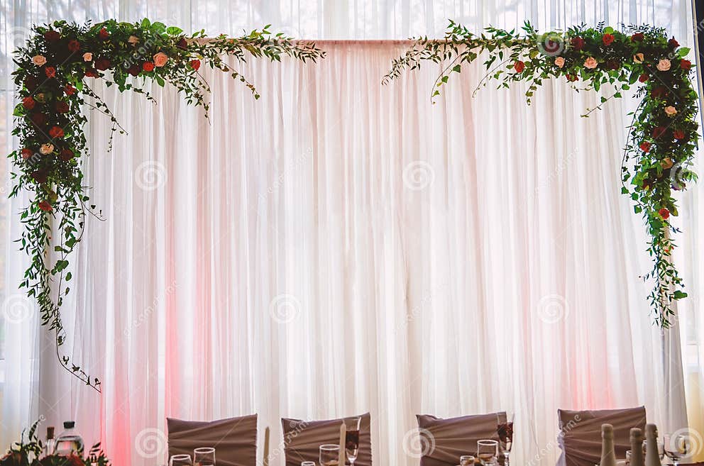 A Rectangular Frame with Plants and White Tulle Decorates the Festive ...