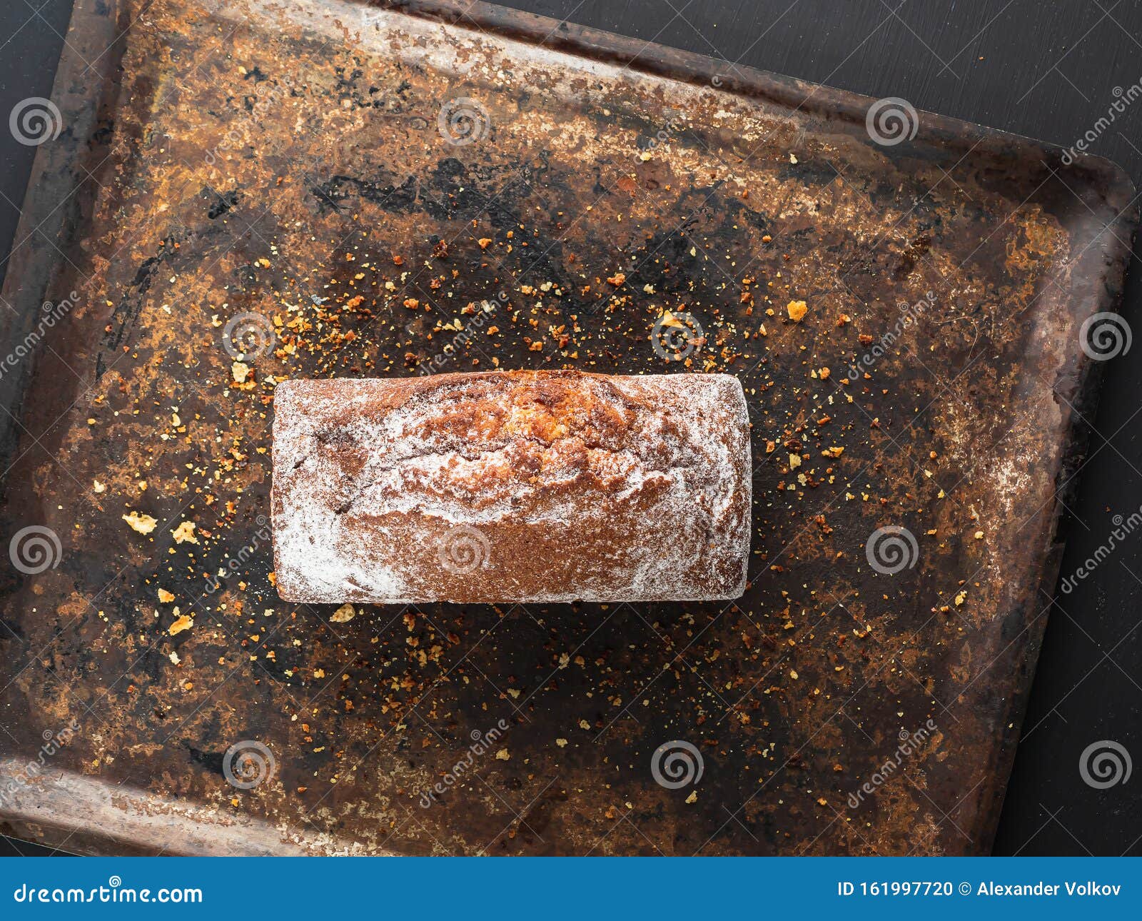 A Rectangular Loaf with White Topping Sits on a Rusty Protwin Stock ...