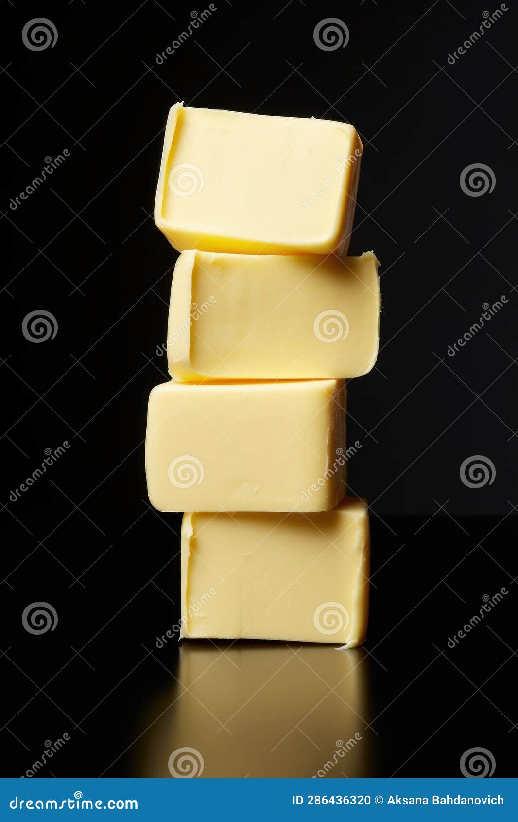 Rectangular Pieces of Butter on a Dark Background Vertical Photo ...