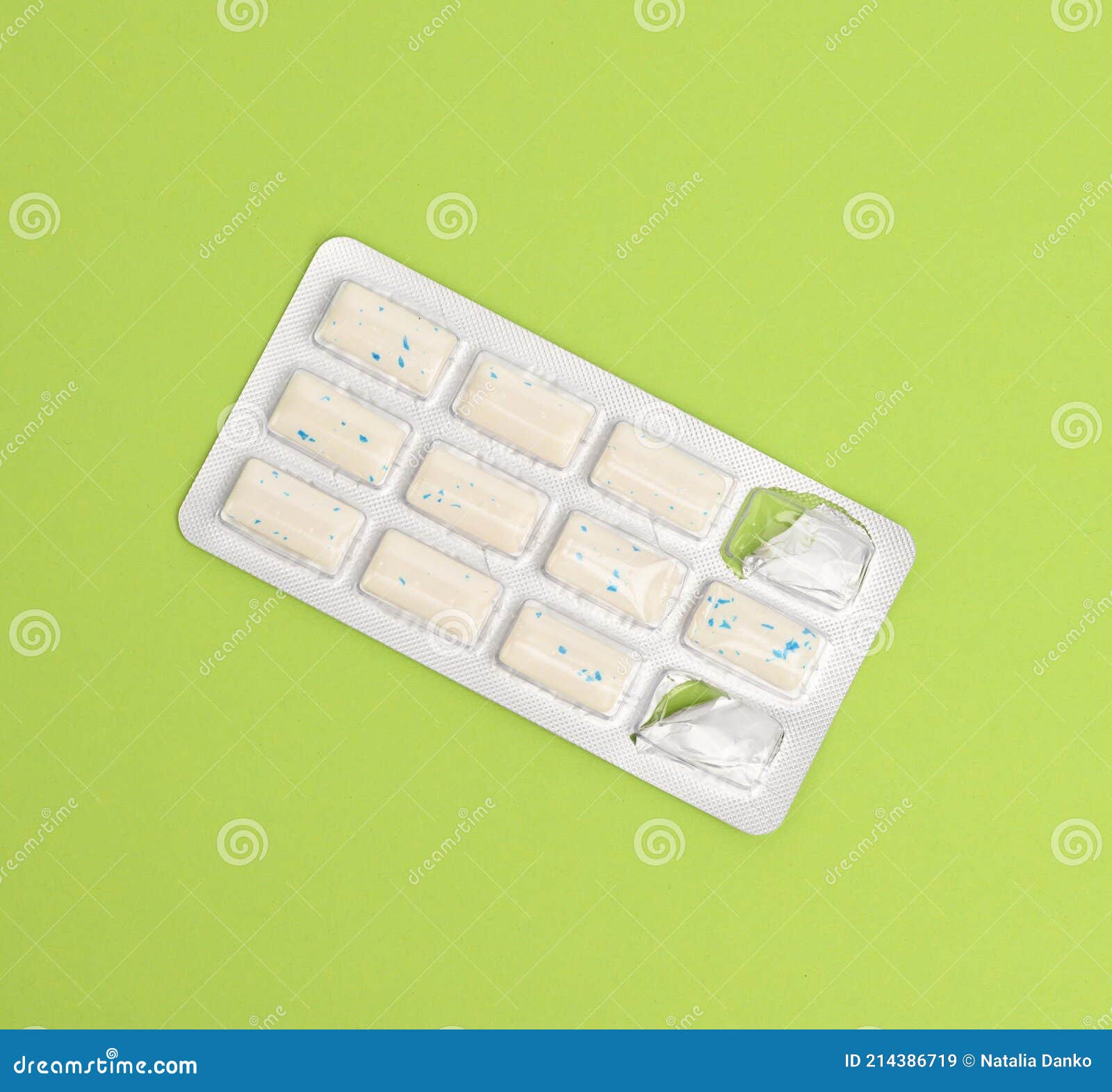 Rectangular Pieces of Gum in a Blister Pack on a Green Background Stock ...