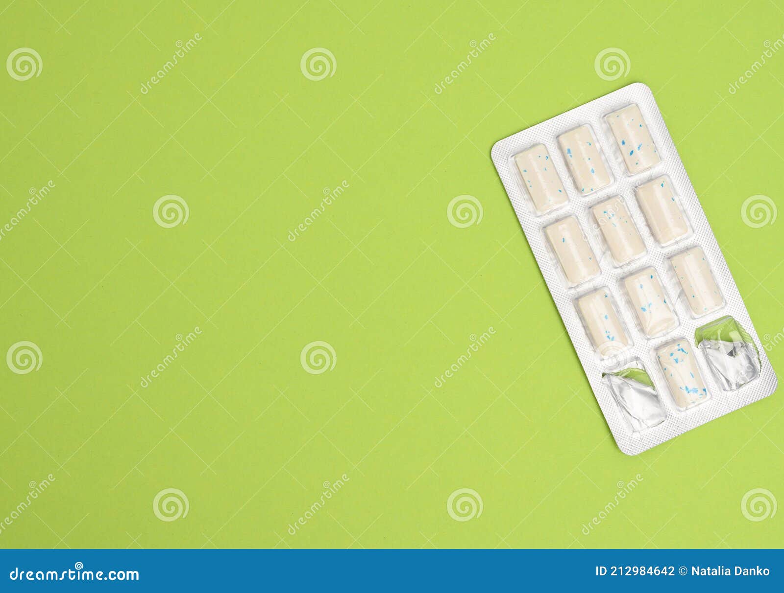 Rectangular Pieces of Gum in a Blister Pack on a Green Background ...