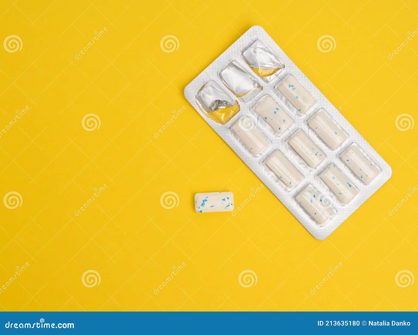 Rectangular Pieces of Gum in a Blister Pack on a Yellow Background ...