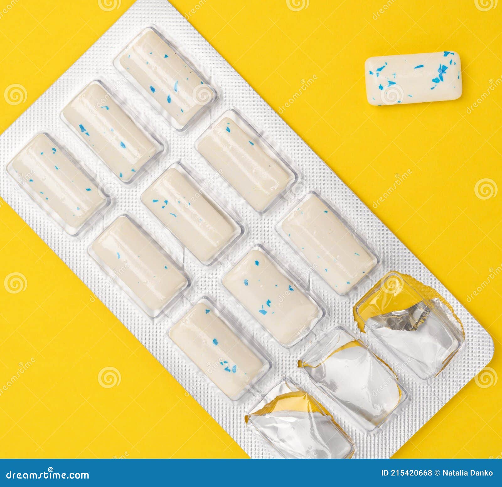 Rectangular Pieces of Gum in a Blister Pack on a Yellow Background ...