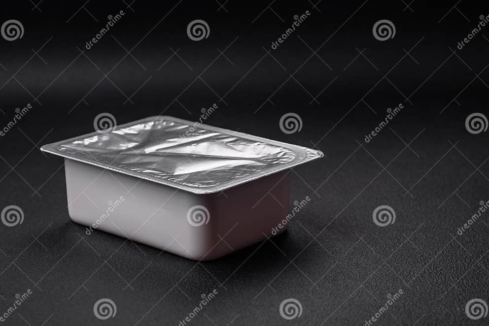 Rectangular Plastic Box with Yogurt or Cheese Hermetically Sealed with ...