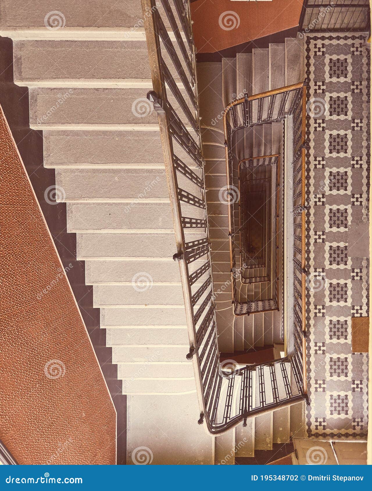 Rectangular Spiral Staircase with Red Wall Black Railings and Square ...