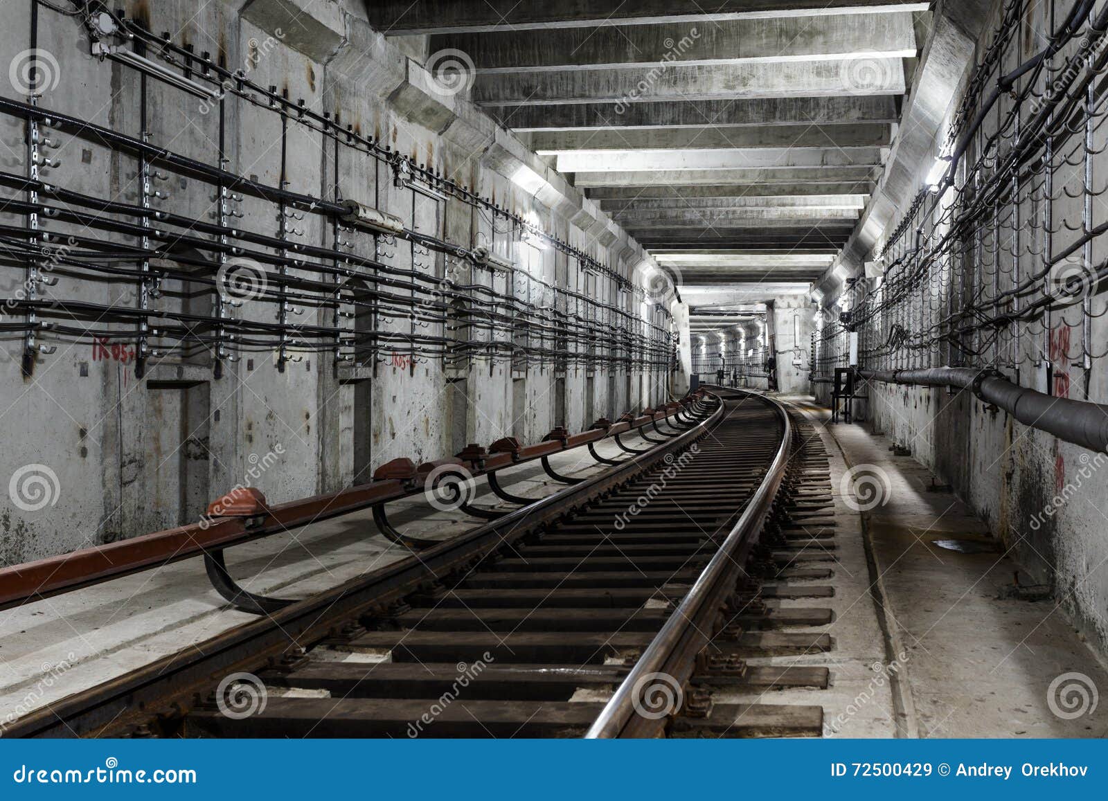 Rectangular Subway Tunnel with a Turn To the Left and White Lighting ...
