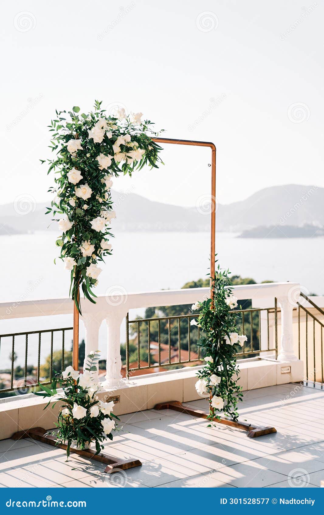 Rectangular Wedding Arch Stands on a Terrace Above the Sea Against the ...