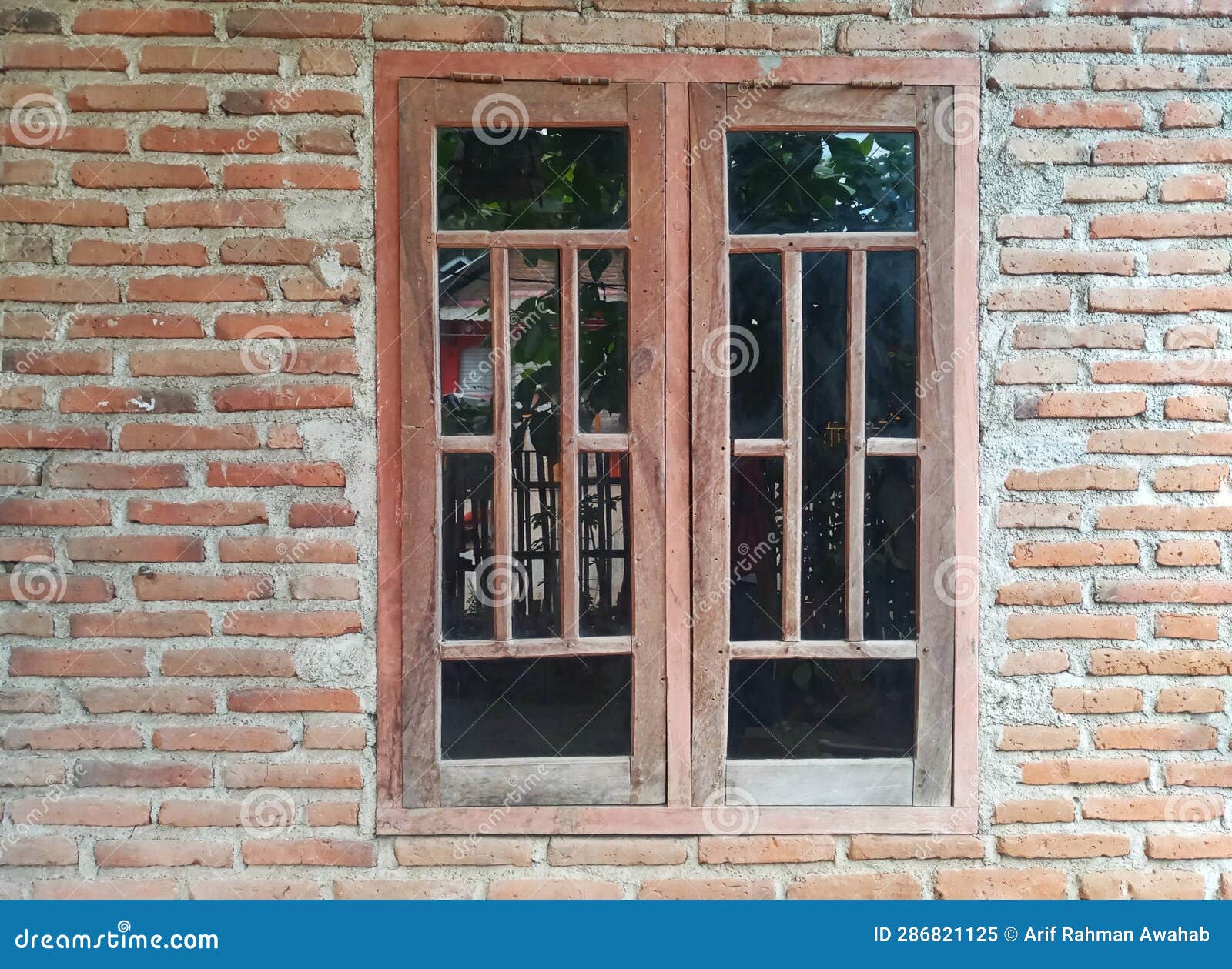 Rectangular Wooden Window Frame with Black Glasses on Unfinished House ...