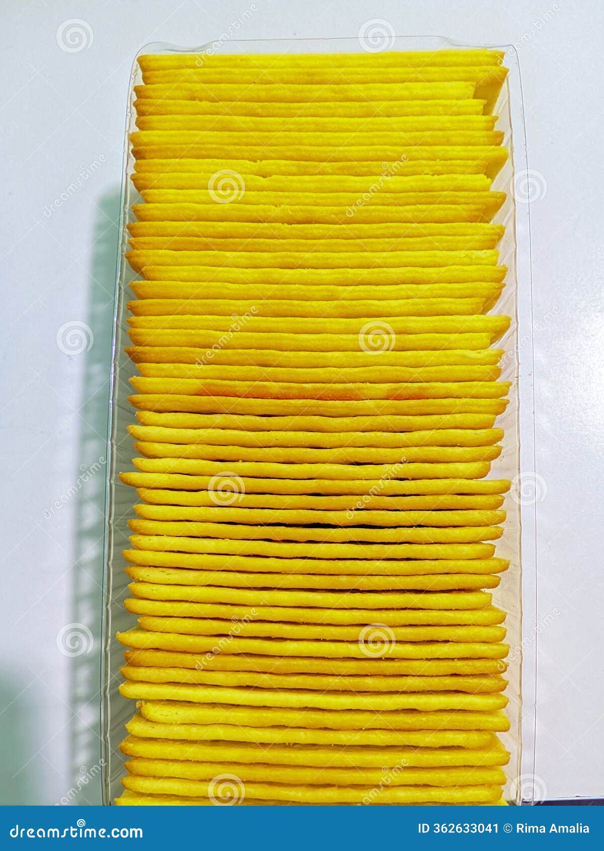 Rectangular Yellow Crackers are Neatly Stacked in Transparent Plastic ...