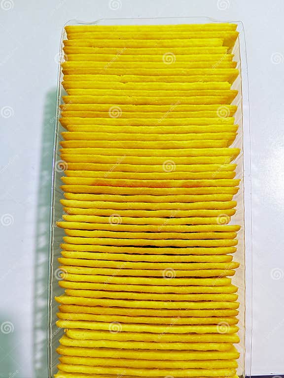 Rectangular Yellow Crackers are Neatly Stacked in Transparent Plastic ...