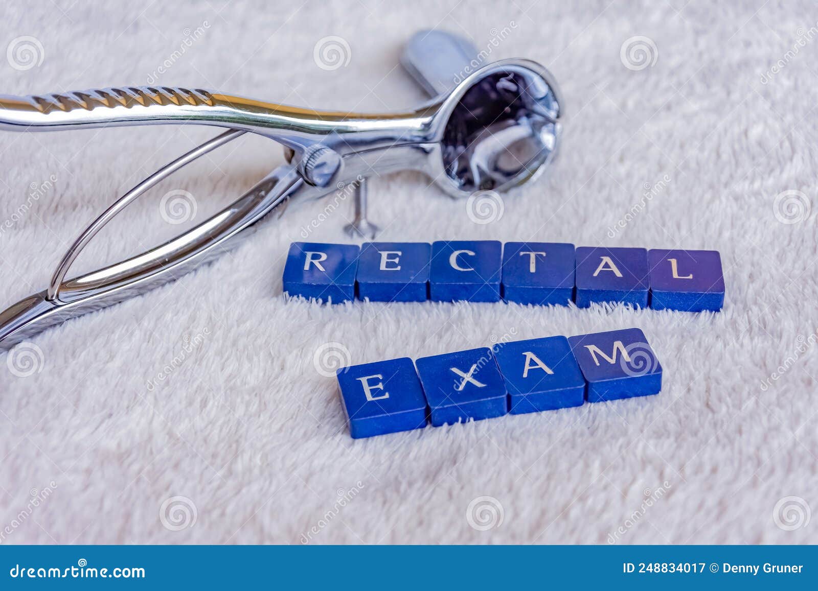 Rectoscope with the Words Rectal Exam on a White Blanket Stock Image ...