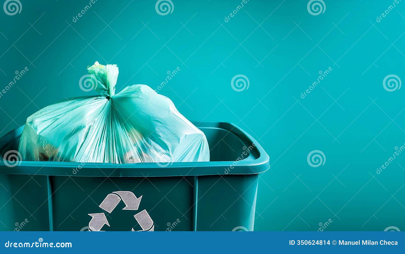 A Recycling Bin Filled with a Plastic Rubbish Bag Highlights ...